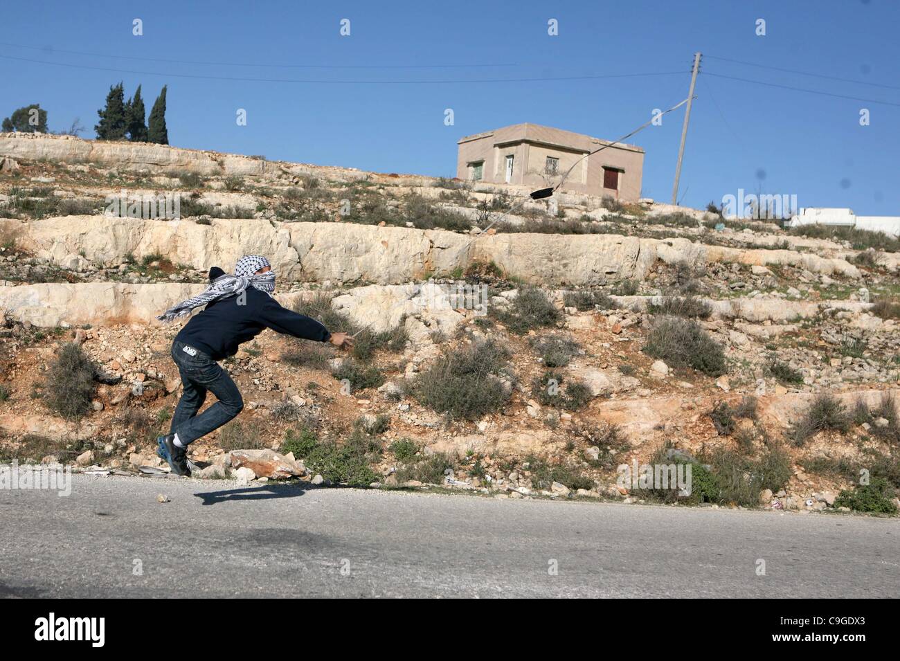 Palestinian youth uses sling stone hi-res stock photography and images ...