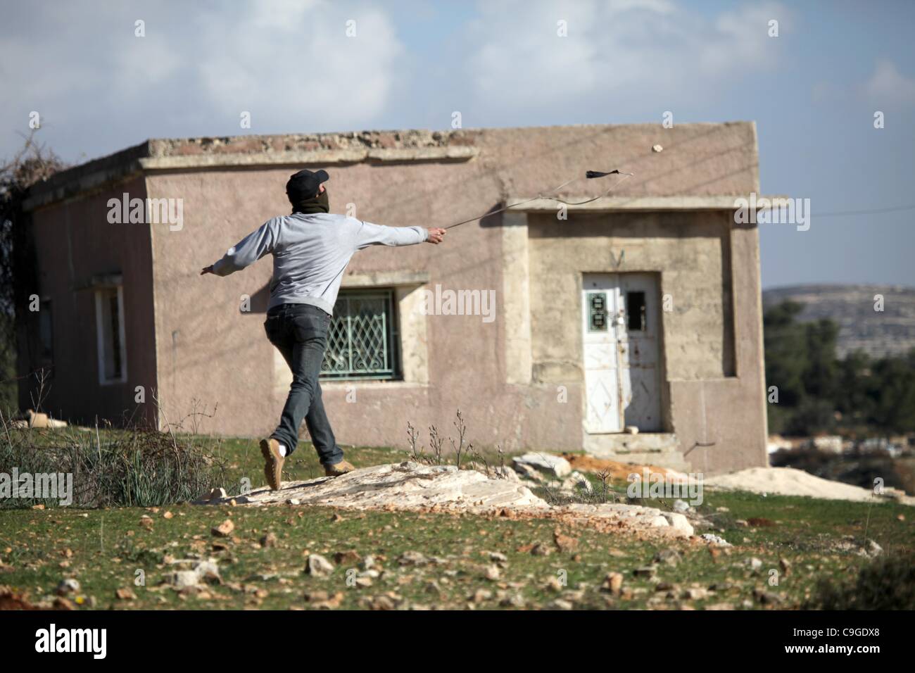 Palestinian youth uses sling stone hi-res stock photography and images ...