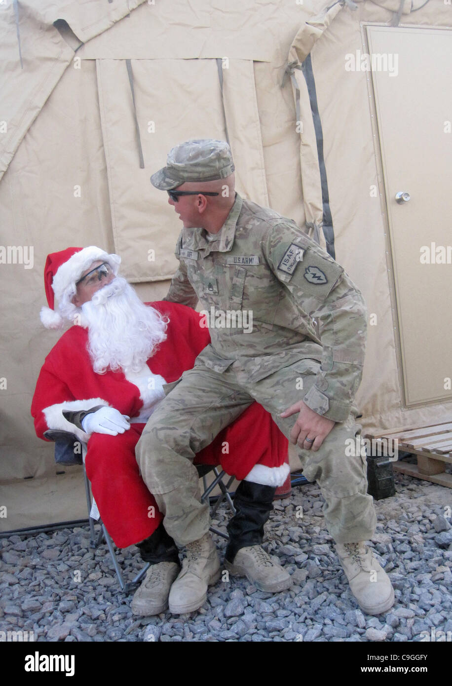 Sft. Sgt. Kirk Goff, 25, Swansea, S.C., sits on the lap of Battalion ...