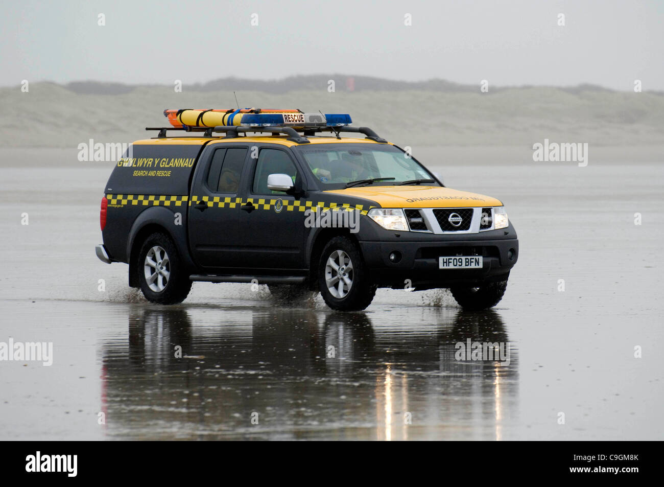 Pembrey, Llanelli, UK. 26th Dec, 2011. Coastguard 4x4 on the beach at ...
