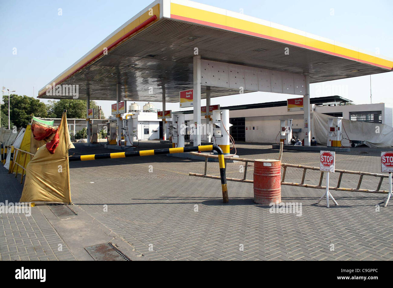 A compressed natural gas (CNG) station is seen closed with hurdles due ...