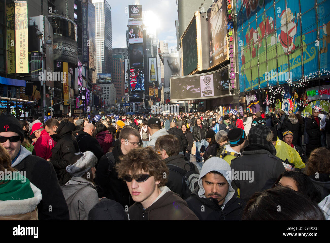 Crowds in New York City's Times Square await the arrival of 2012 on New ...