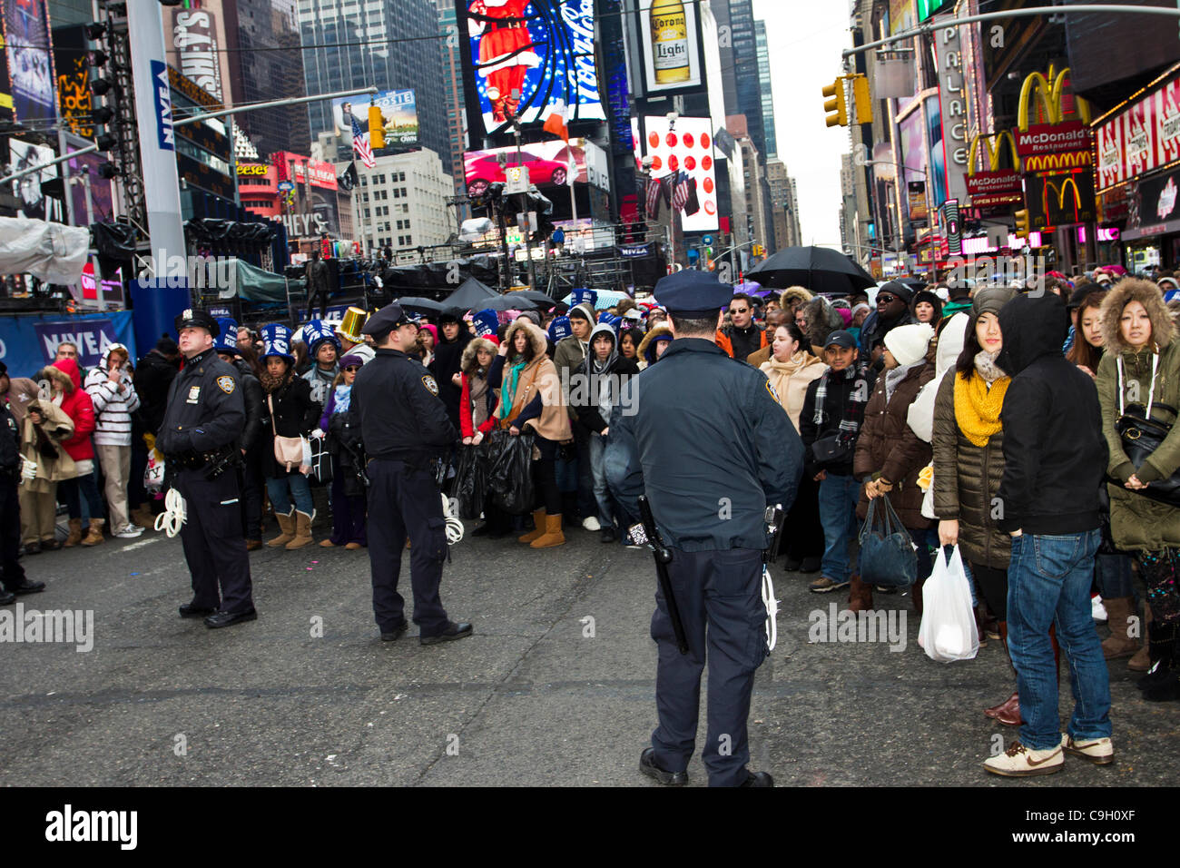 Police control crowds in Times Square on New Year's Eve 2011. More than ...