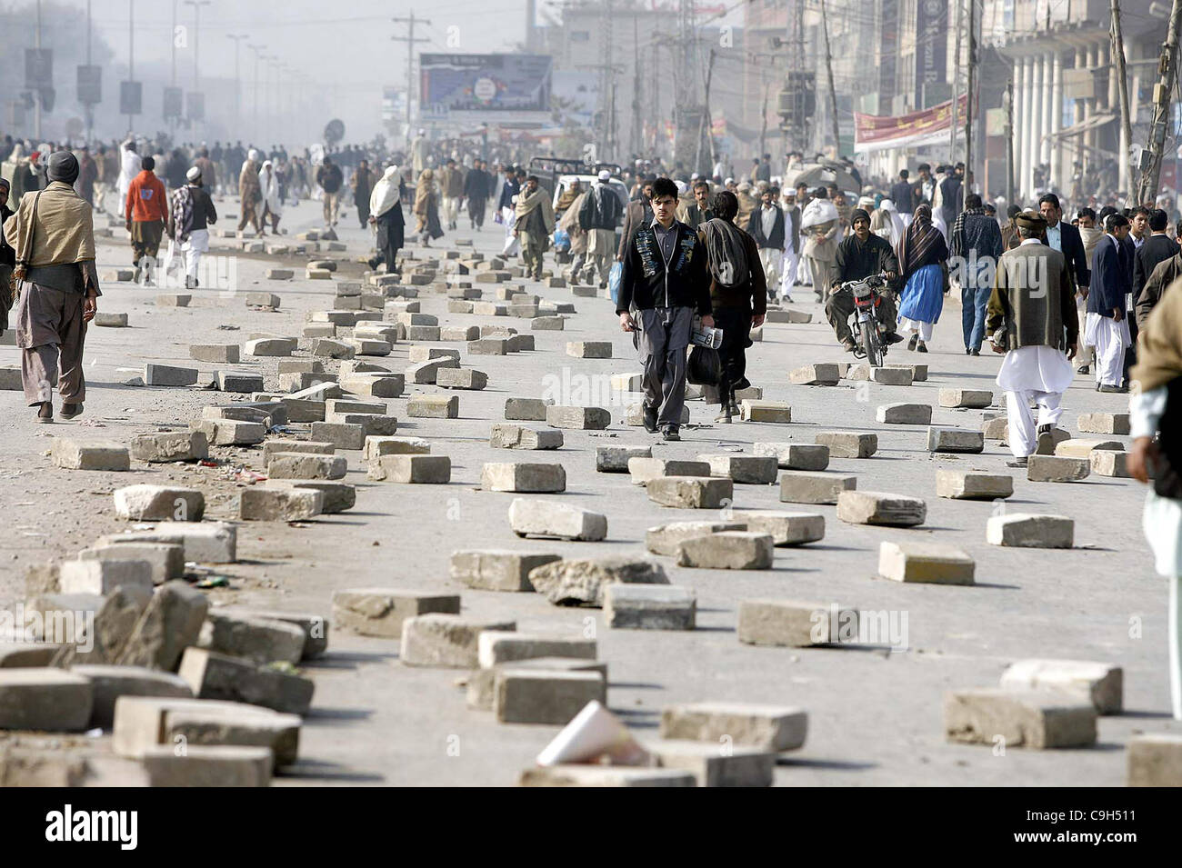 People pass through bricks pelted hi-res stock photography and images ...