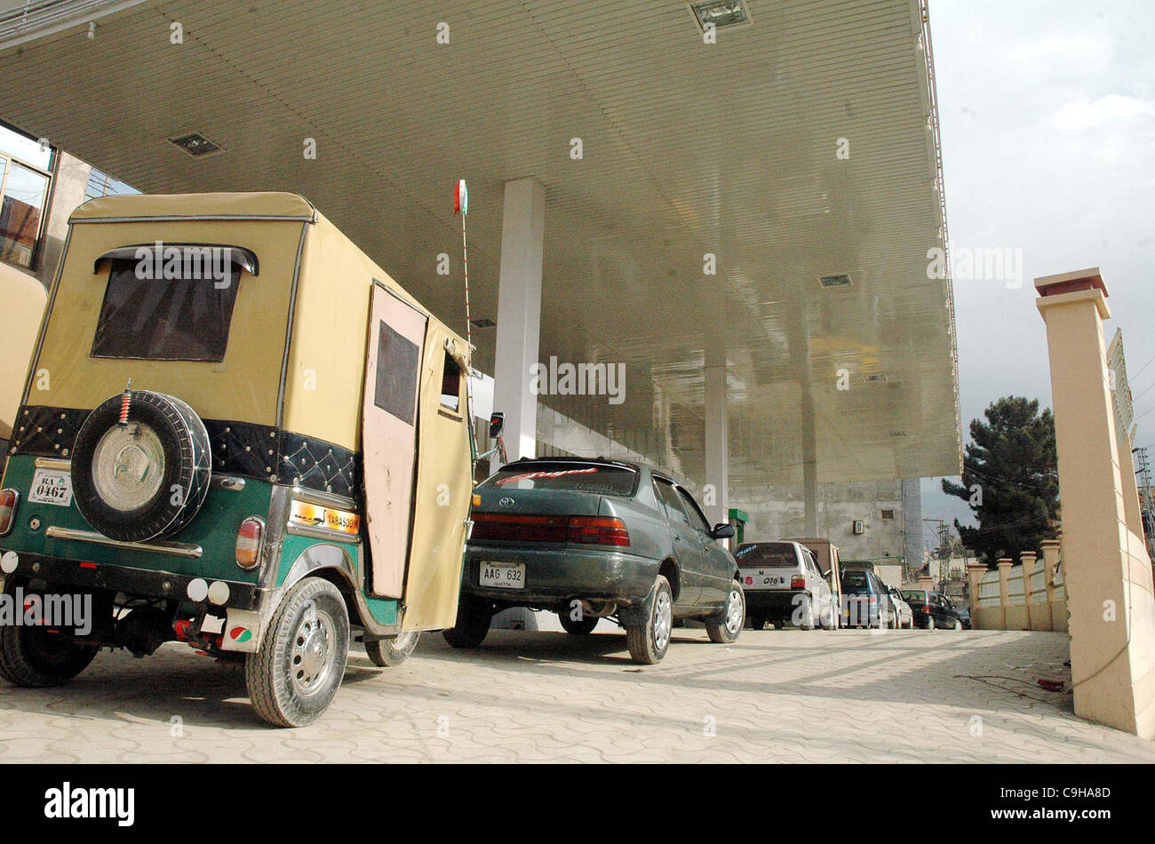 Motorists stand in queue to fill gas at a Compressed Natural Gas (CNG ...