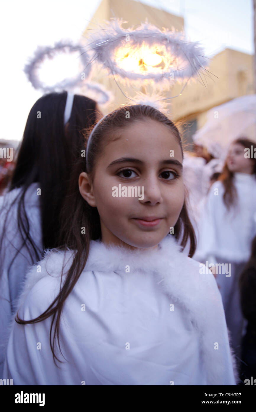 Young Israeli Arab Christian girls wearing angel costume take part in ...