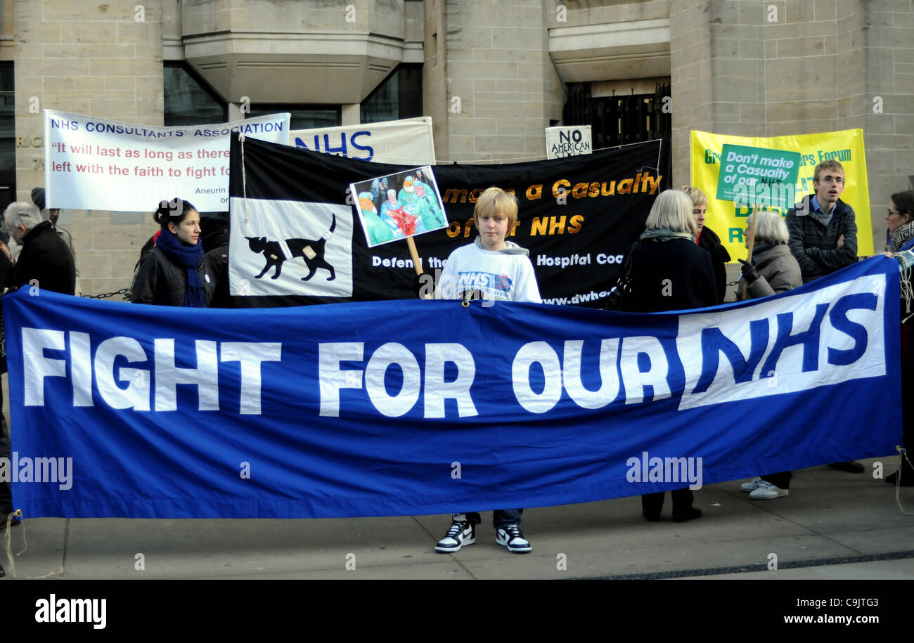 London, UK. 15/01/12. Protesters with banners wait for the runners at ...