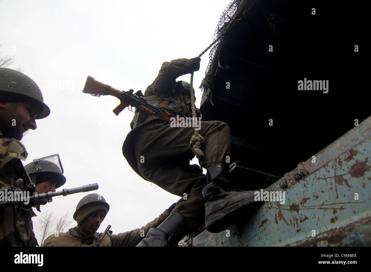 indian paramilitary soldiers comeing out form a soldier vichal out side ...