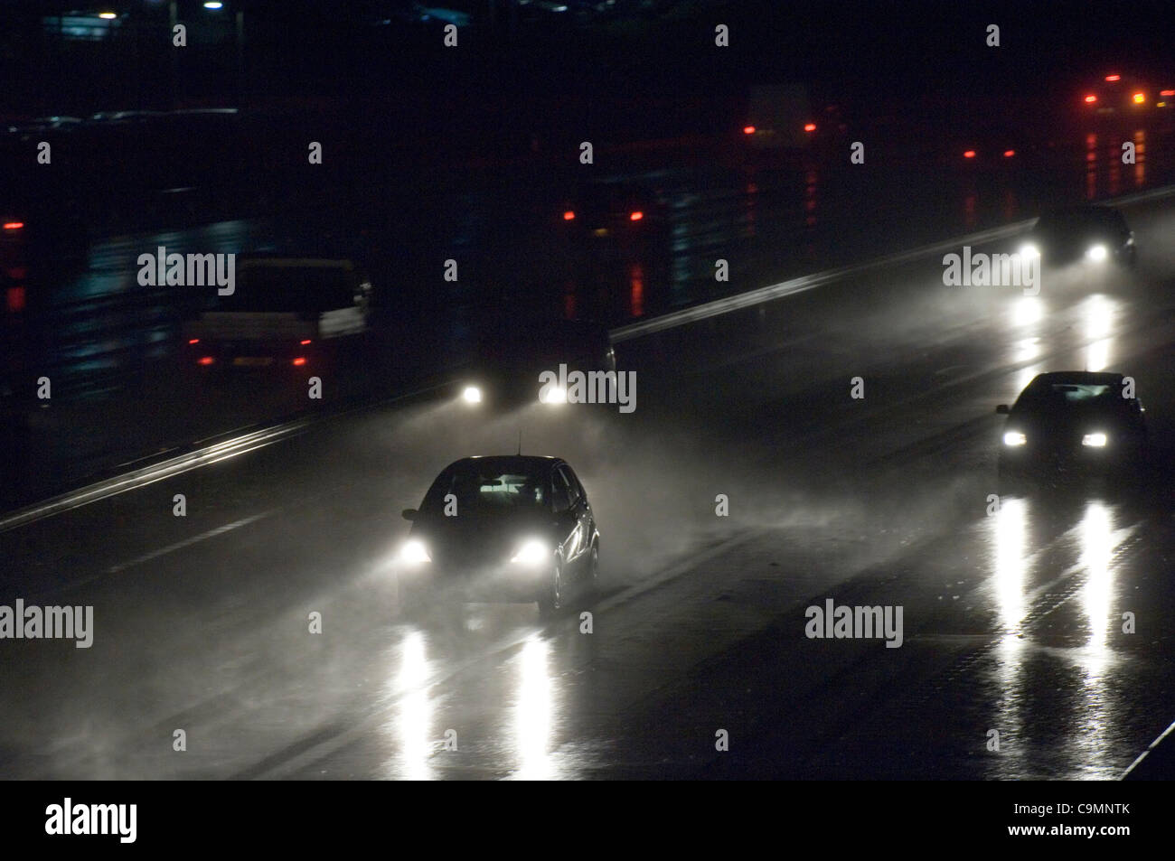 Rush hour motorists driving through sleet on the M4 near Cardiff, South ...