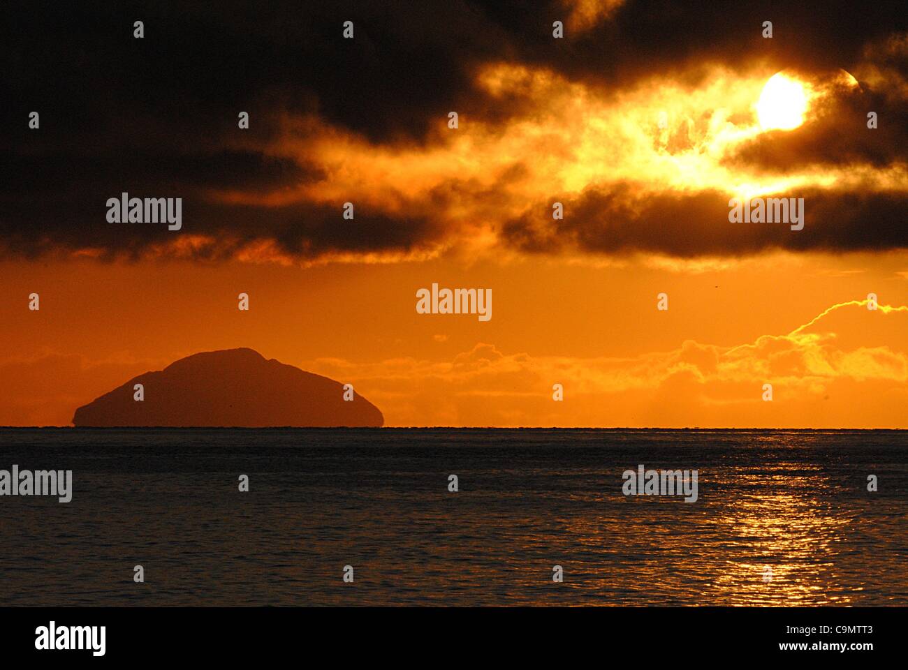 Ayr, UK - 27/1/12 The sun sets over Ailsa Craig and The River Clyde ...