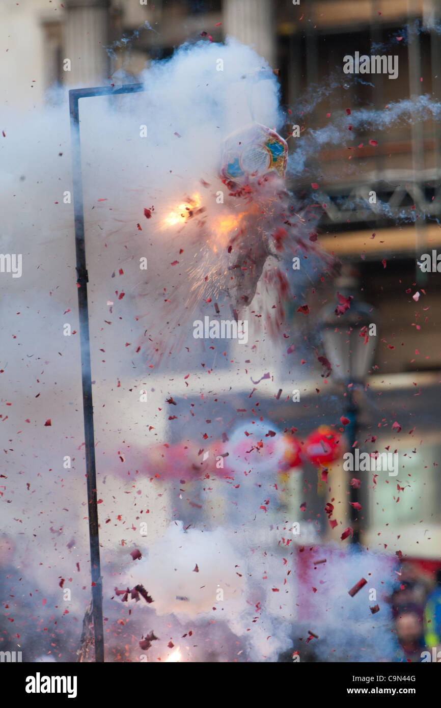 Firecrackers exploding during celebrations to mark the Chinese New Year, the Year of the Dragon ...