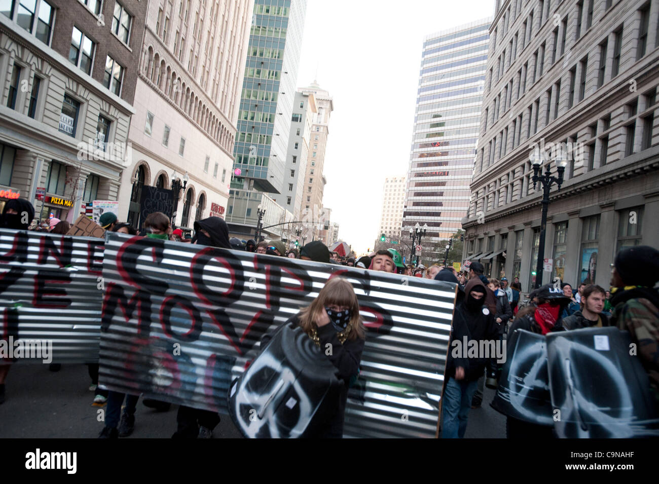 Occupy Oakland protesters march through downtown Oakland en route to ...