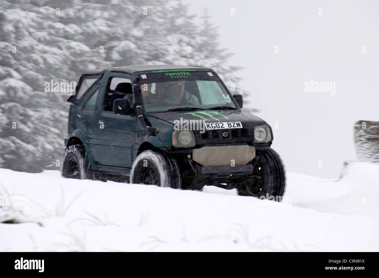 A 4x4 having fun in the snow off the road on the Rhigos Mountain in the ...