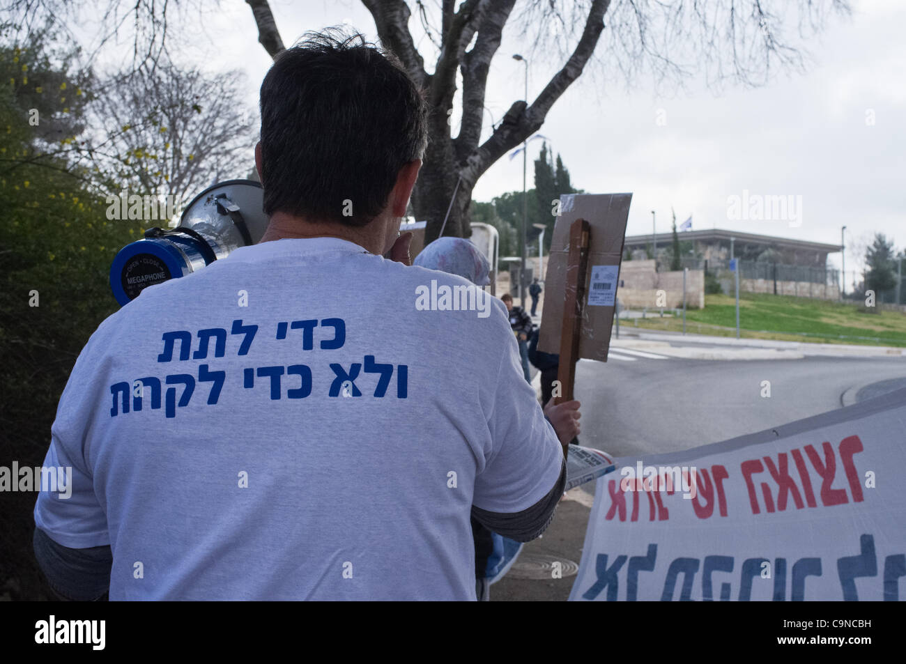 Man wears a T-shirt reminding elected Knesset members they are there to ...