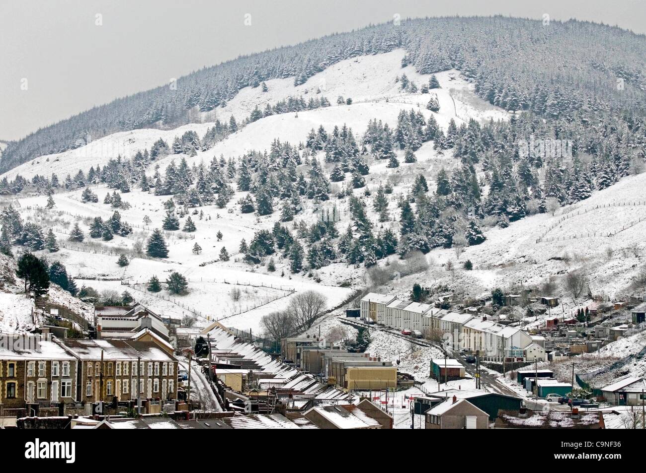 Snow covered houses in the small remote village of Abergwynfi in the ...