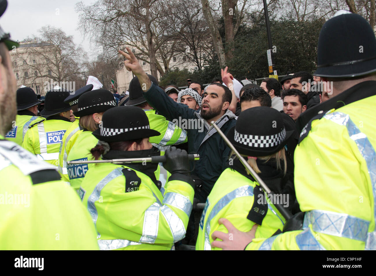 Police and protesters clash outside the Syrian Embassy in London Stock ...
