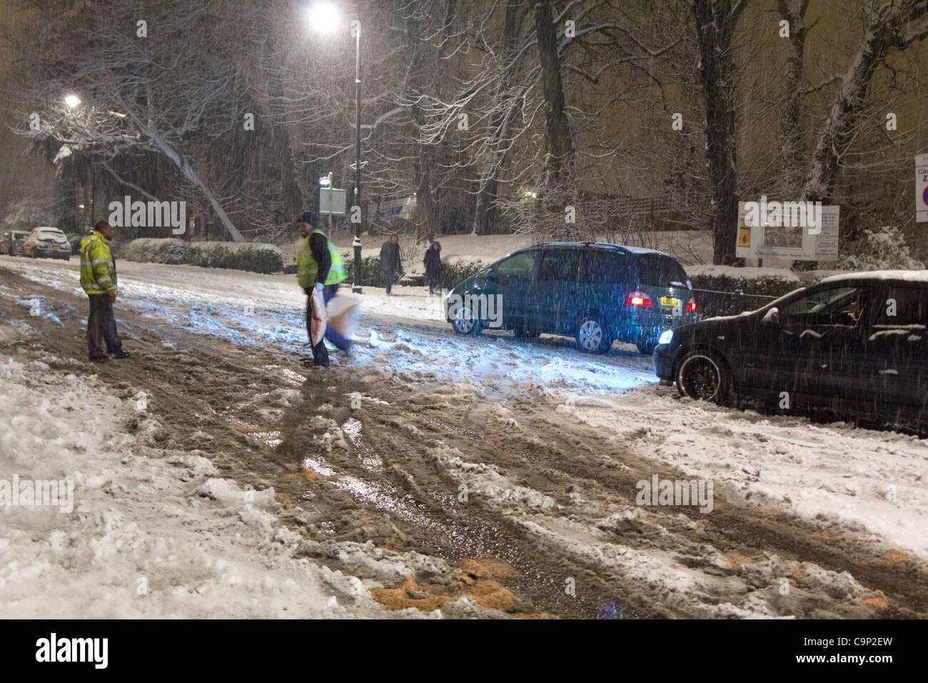 London, UK. 5th Feb, 2012. Bus Drivers trying to grit road during ...