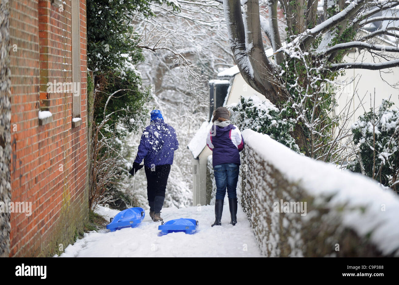 A couple with sledges out enjoying the snow in Lewes East Sussex this ...