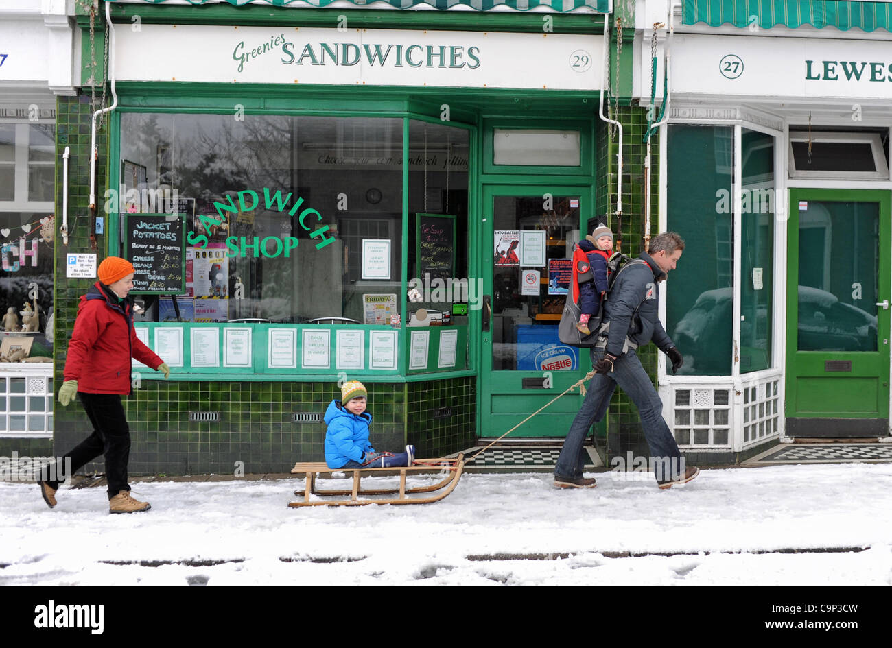 A family make the most of the snow in Lewes East Sussex this morning ...