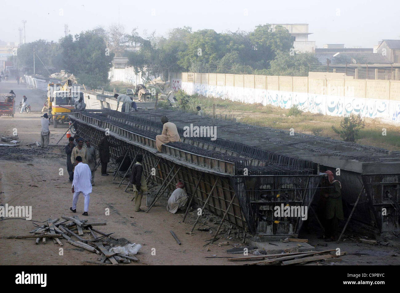 Labors busy in construction work of bridge at SITE area in Karachi on ...