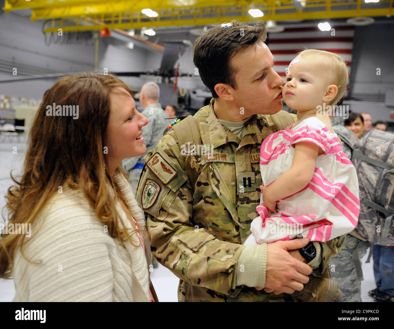 Feb. 8, 2012 - Las Vegas, Nevada, USA - Capt. BEN BUCHTA kisses his two ...