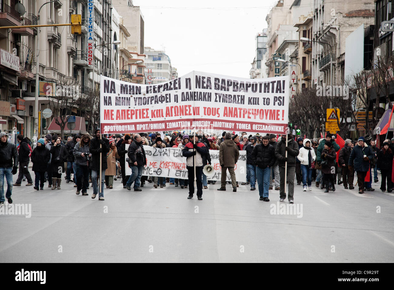 Greek protesters carry a banner against the new austerity measures. 48 ...