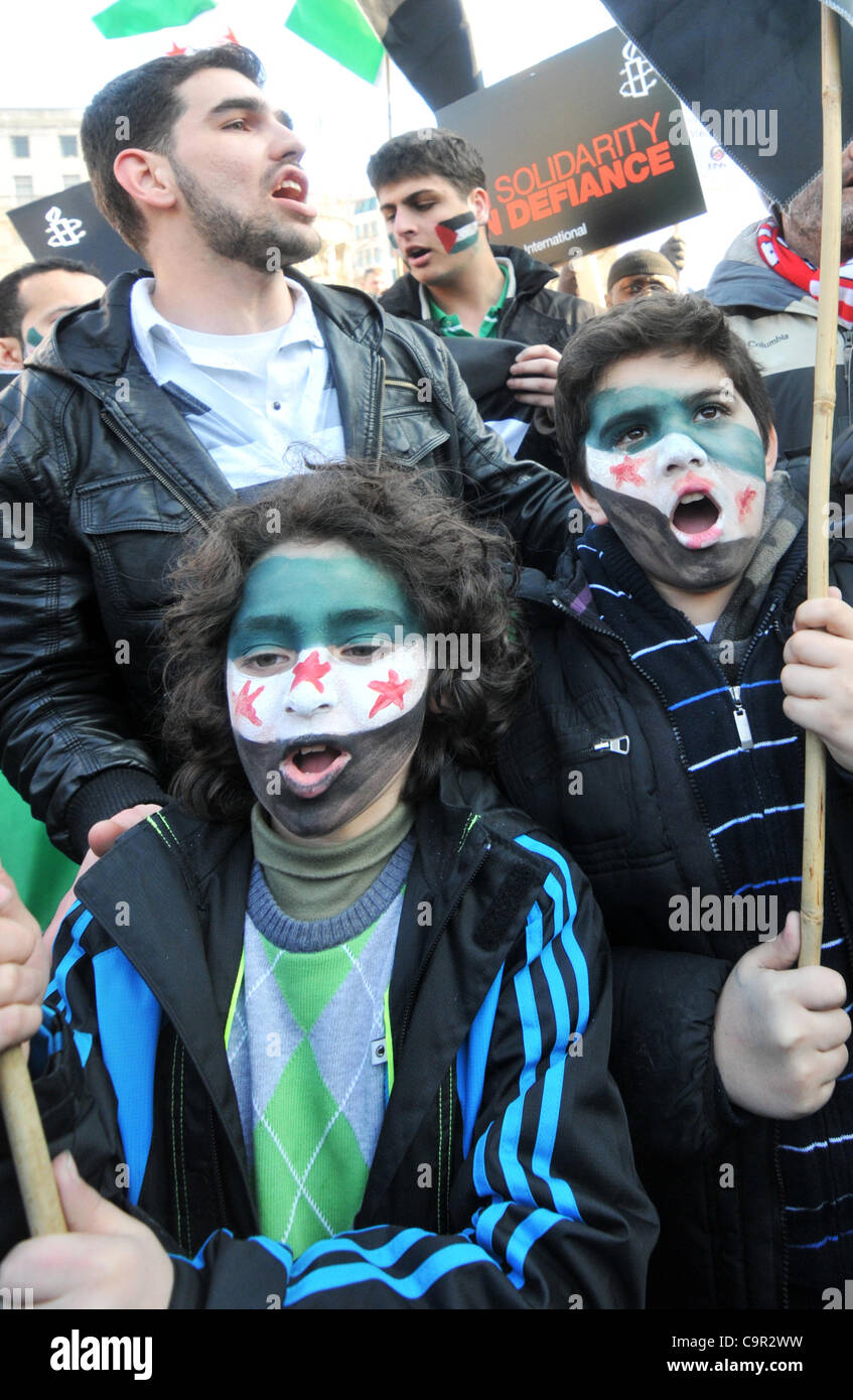Syrian boys with the flag painted on their faces Trafalgar Square ...