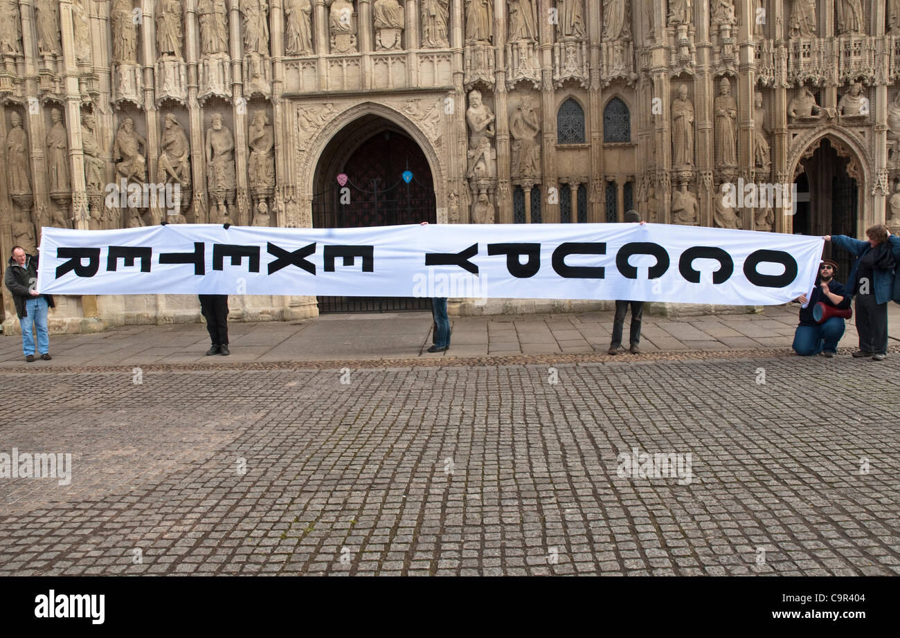The huge Occupy Exeter banner made for site 2 is unfurled and displayed ...