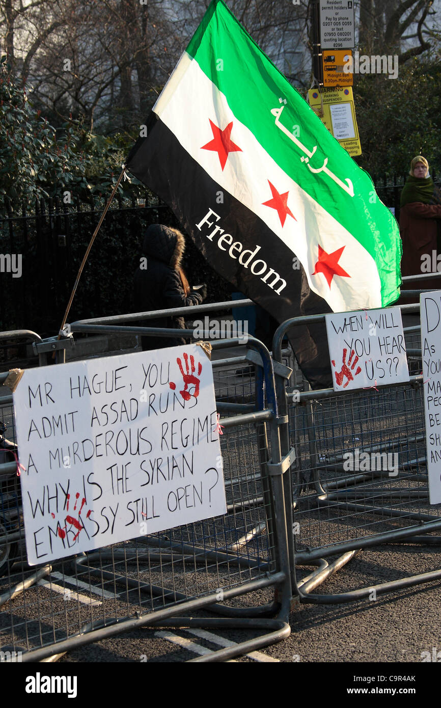 Placards and flag at the Syrian Embassy protest in London Stock Photo ...