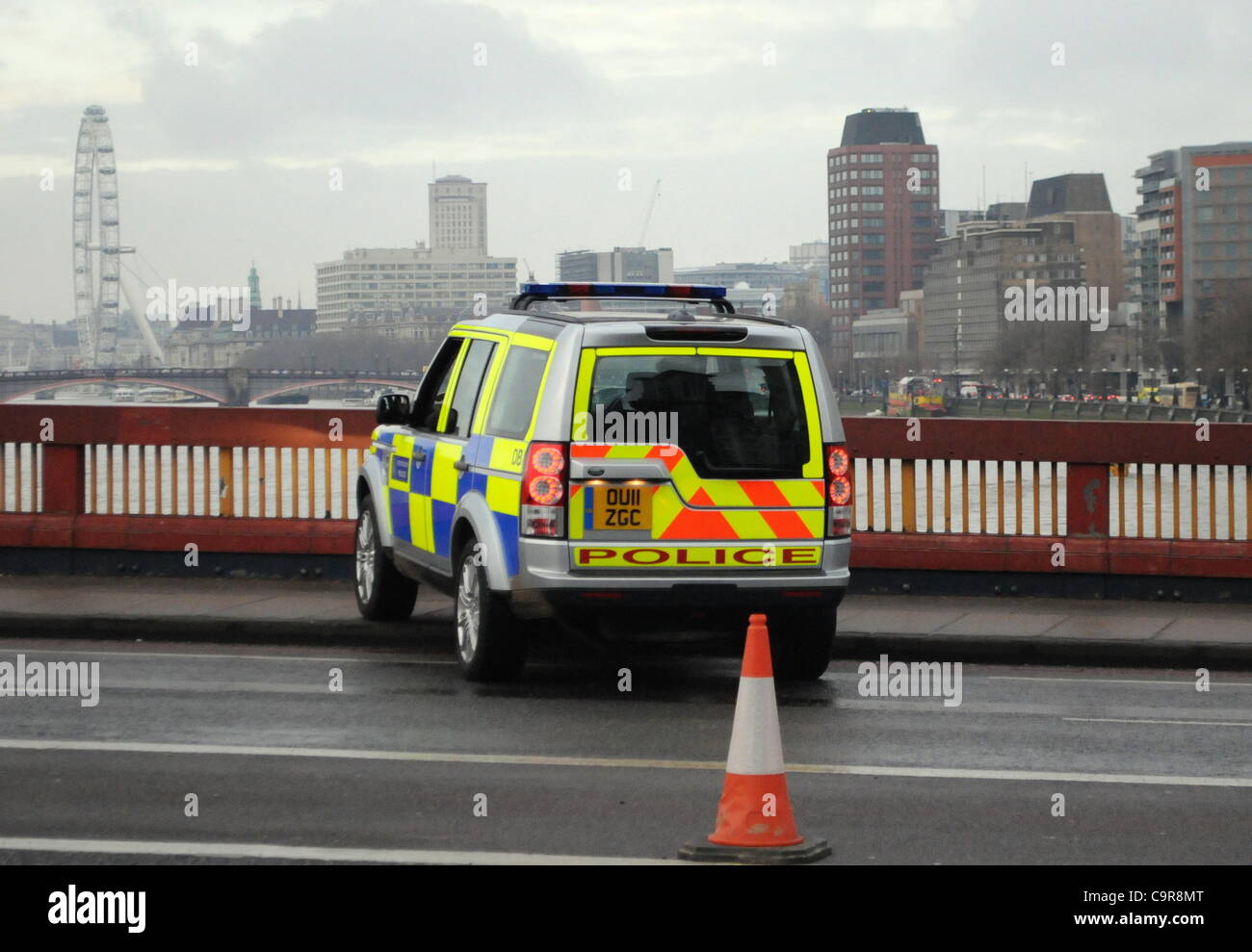London, UK. 12/02/12. A police Range Rover crashes against the barrier ...