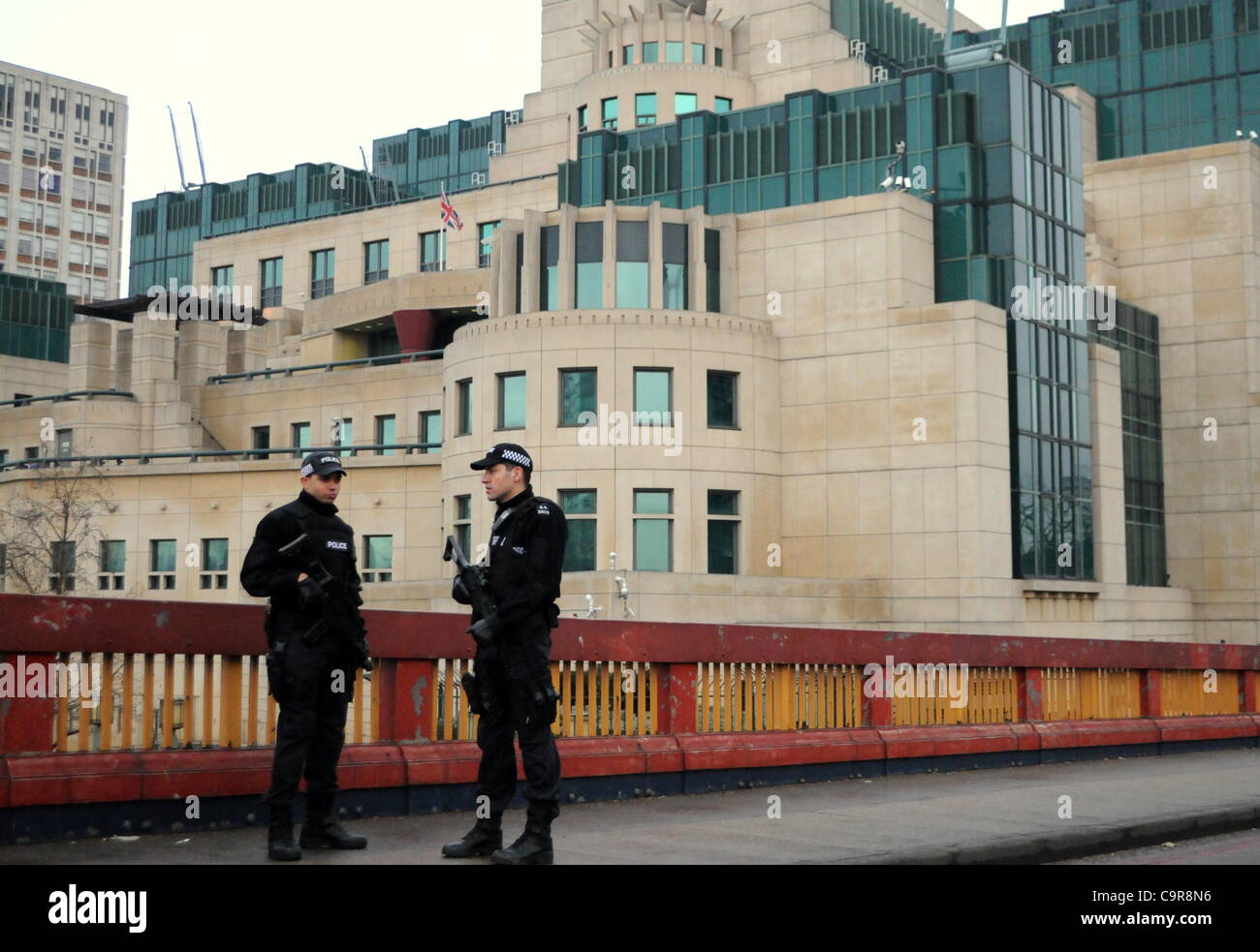 London, UK. 12/02/12. Actors dressed as armed police in a scene from ...