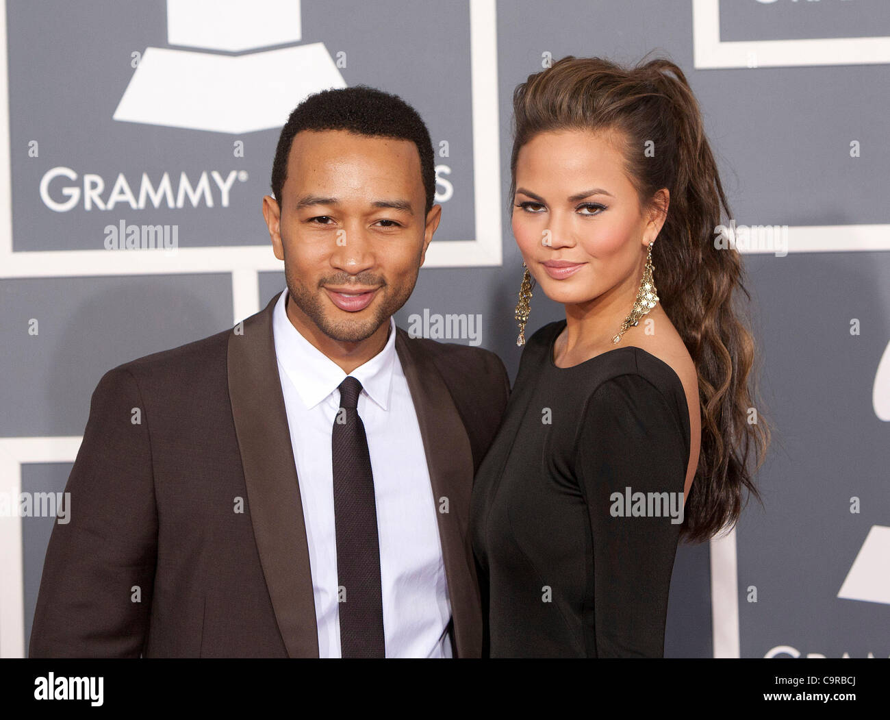 John Legend, Christine Teigen on the red carpet of the 54th Annual ...