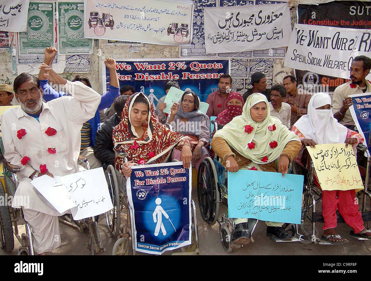 Members of Special Social Welfare Organization chant slogans as they ...