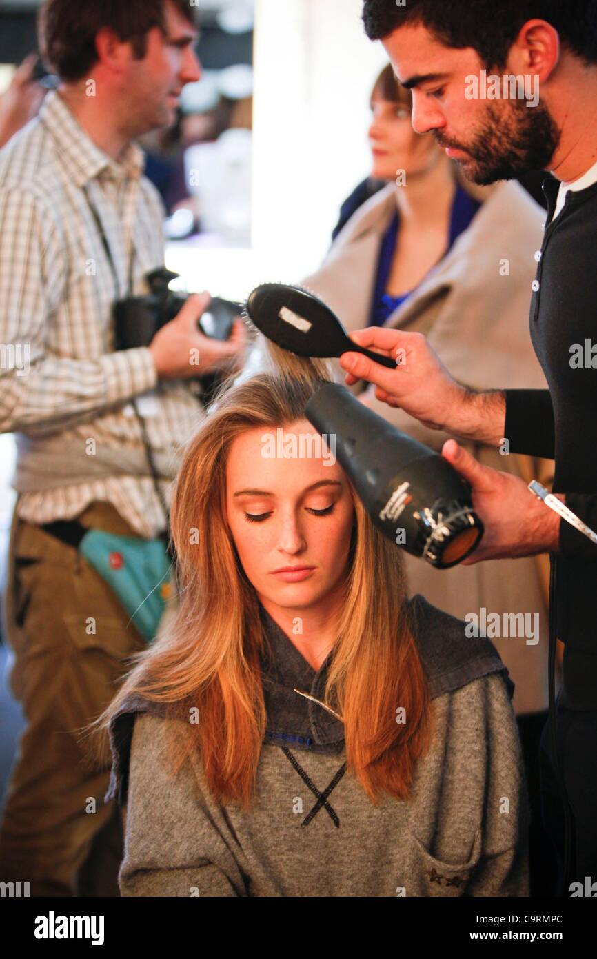 Hair stylist, model backstage for KAREN WALKER Fall/Winter 2012 Fashion ...