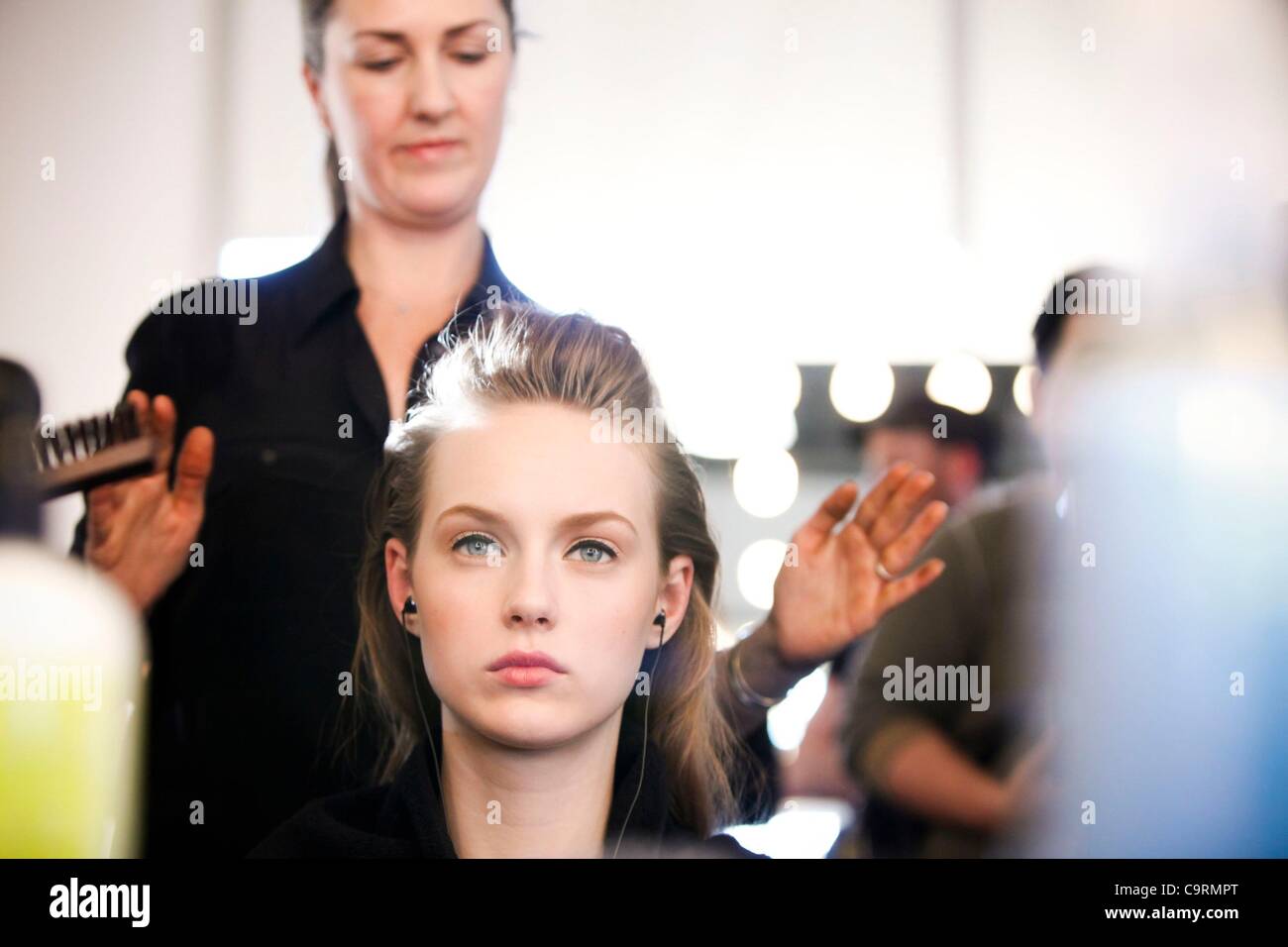 Hair stylist, model backstage for KAREN WALKER Fall/Winter 2012 Fashion ...