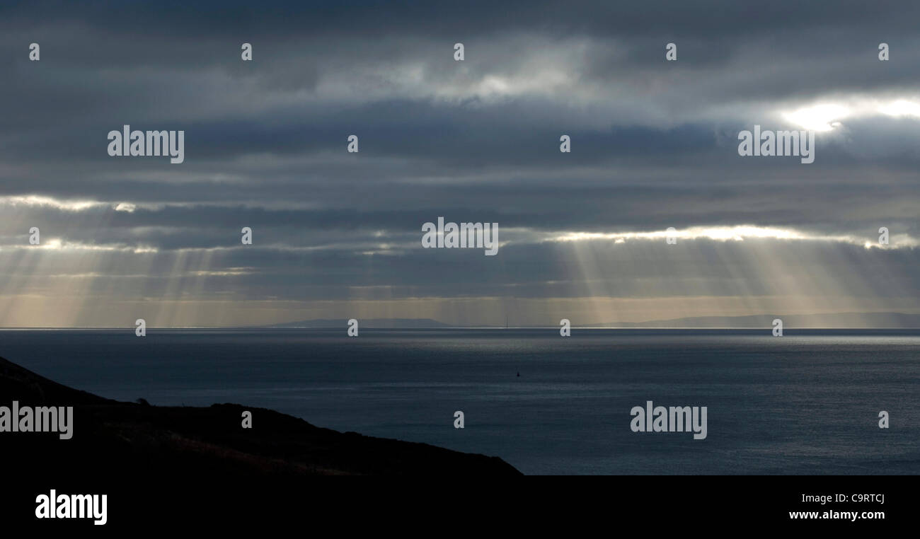 Spectacular sun rays shining down on the coast of North Devon early ...