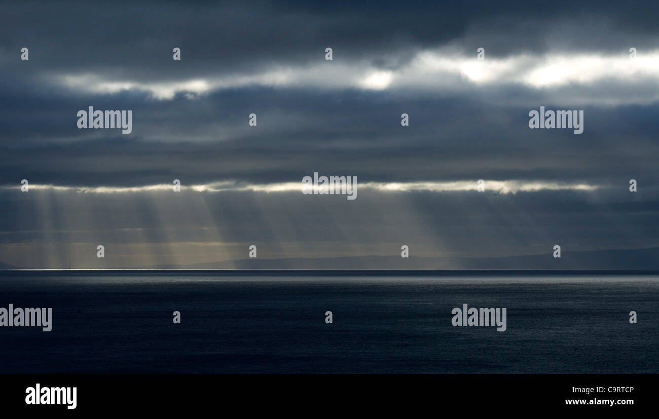 Spectacular sun rays shining down on the coast of North Devon early ...