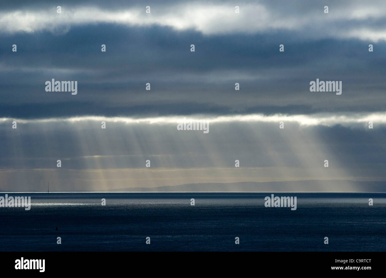 Spectacular sun rays shining down on the coast of North Devon early ...