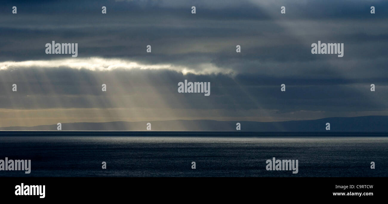 Spectacular sun rays shining down on the coast of North Devon early ...