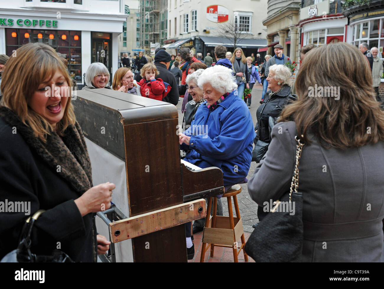 A group of ladies enjoy an impromptu sing song and dance as they borrow ...