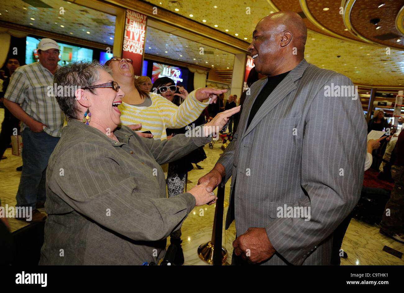Feb. 18, 2012 - Las Vegas, Nevada, US - Gwen Bartholomew (L) taps the ...