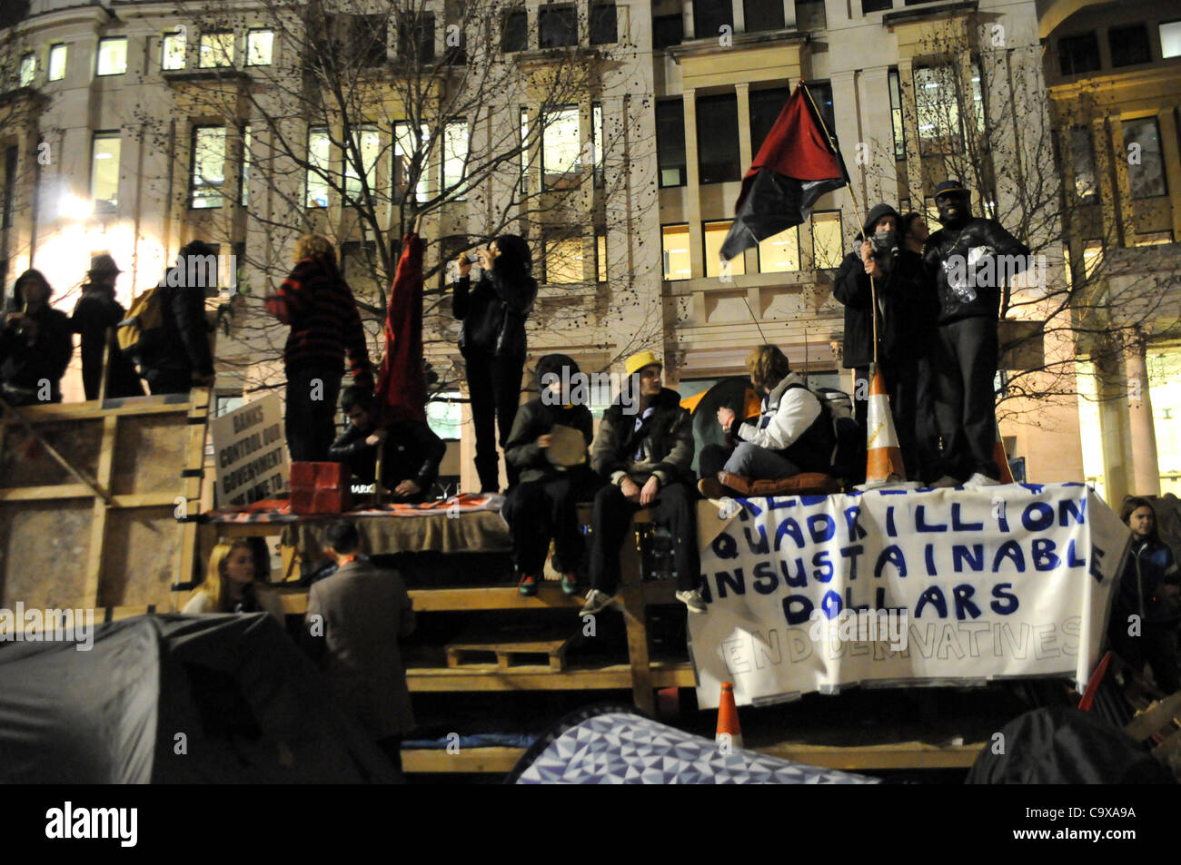 London, UK. 28/02/12. A group of protesters standing on barricades as ...