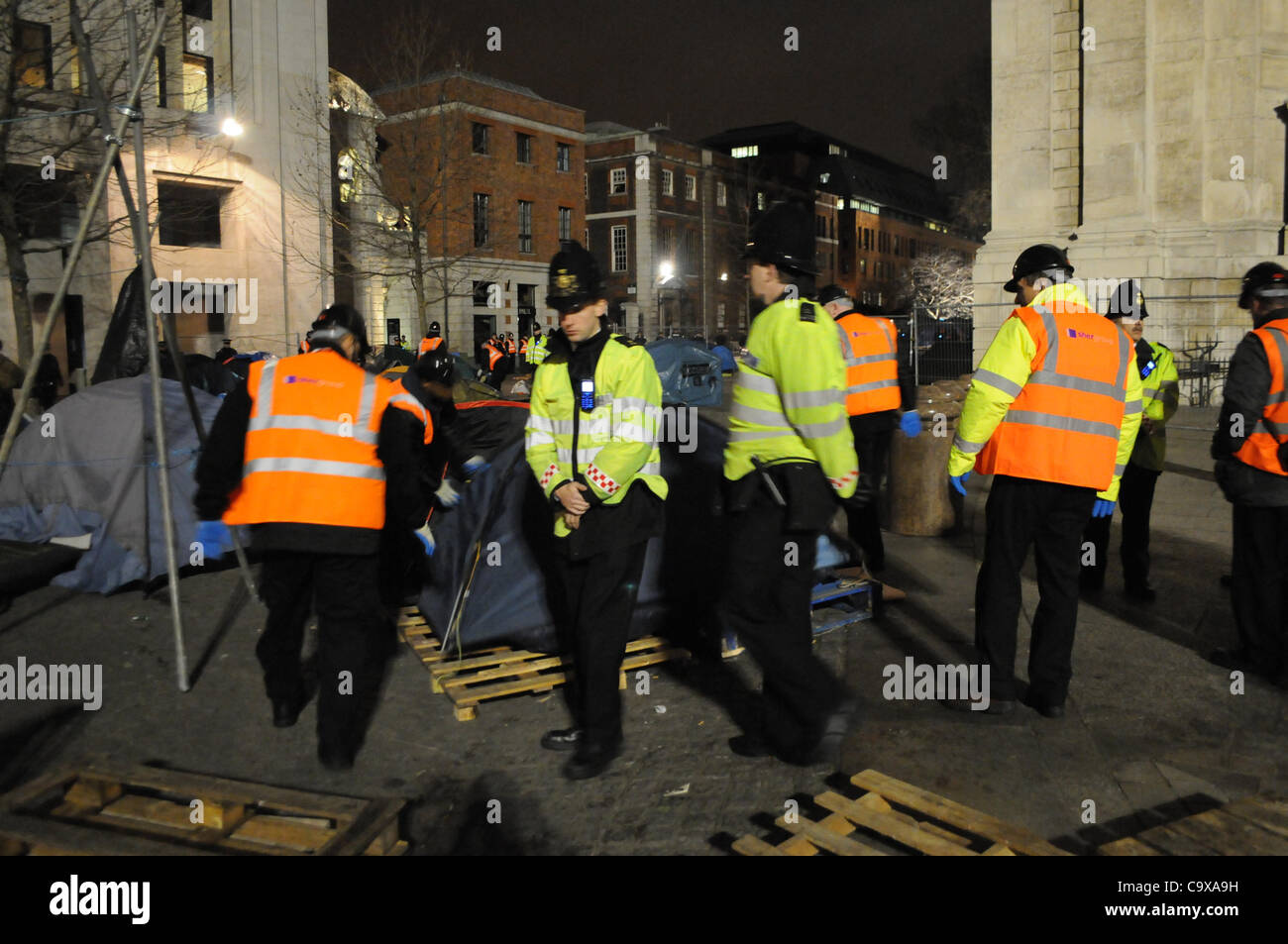 London, UK. 28/02/12. Bailiffs remove tents as they begin the eviction ...