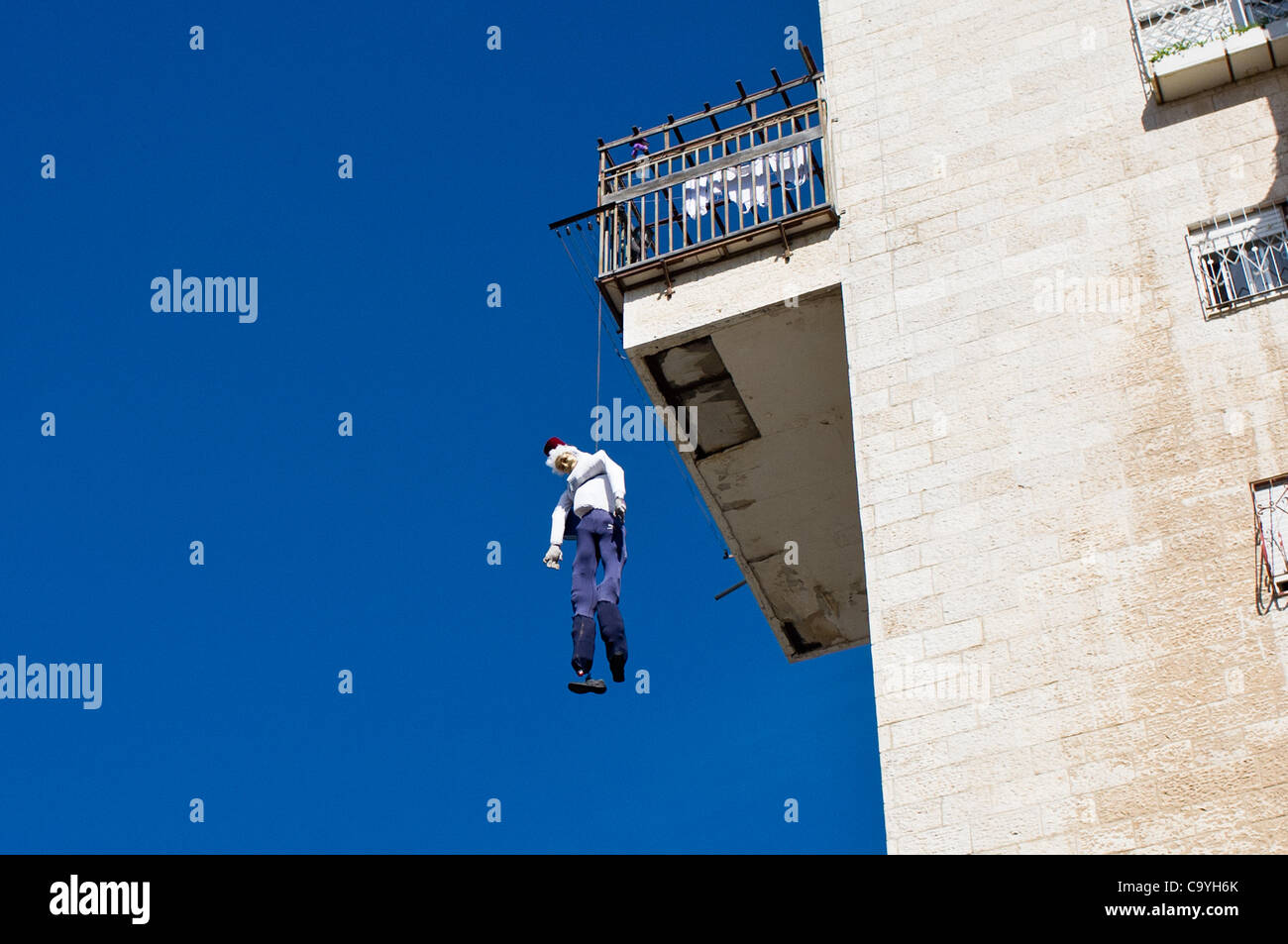 A figure of Haman hangs ‘to death’ from an eighth story balcony ...