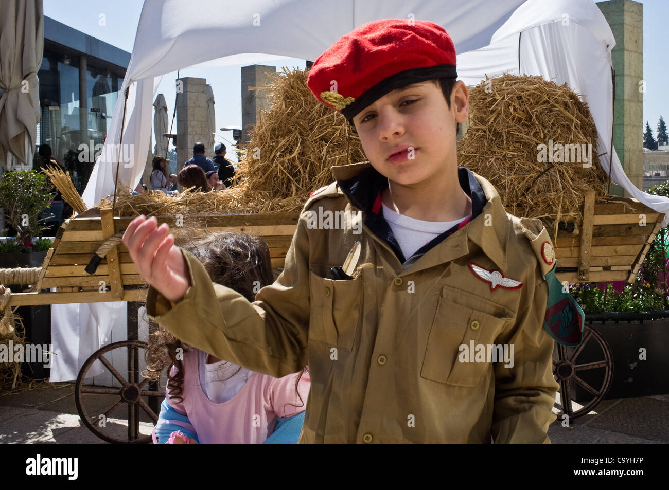 A young boy wears an IDF paratroopers costume on Purim, celebrated as a ...