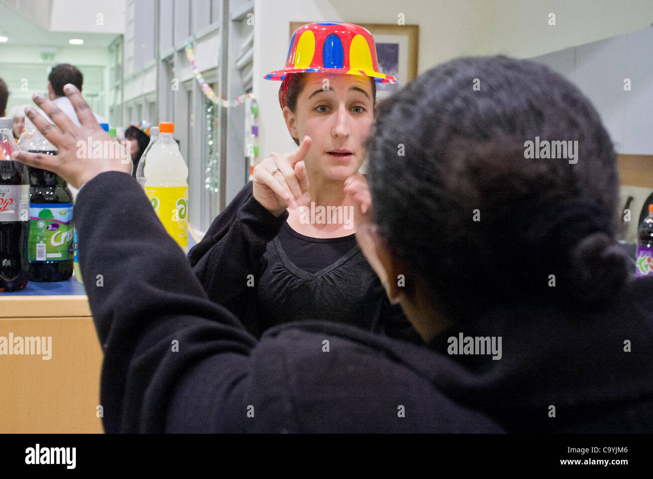 Municipal social worker Merav uses sign language to communicate with ...