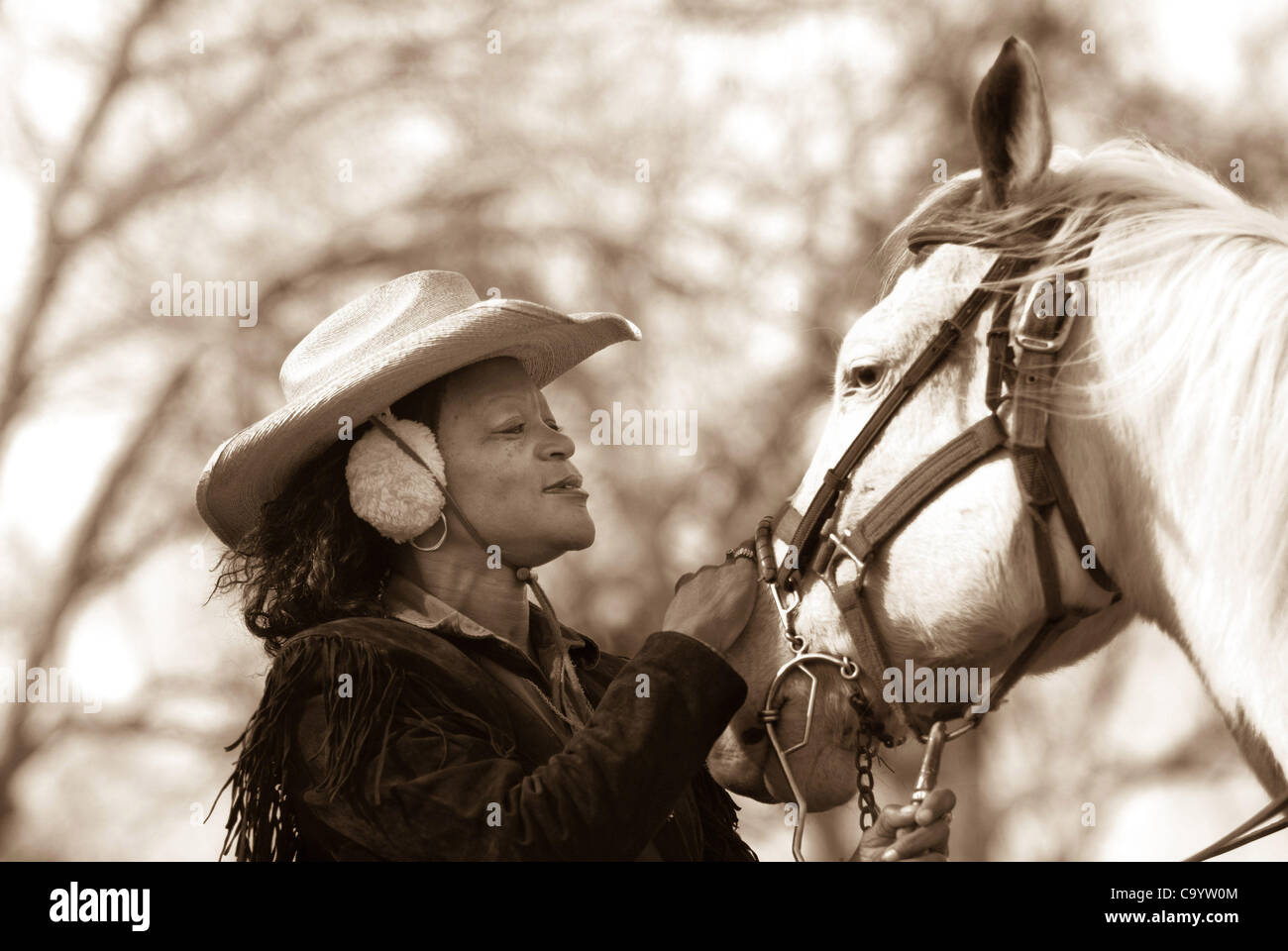 Gee Brown adjusts her horse Surprise's bridal before going on the 11th ...