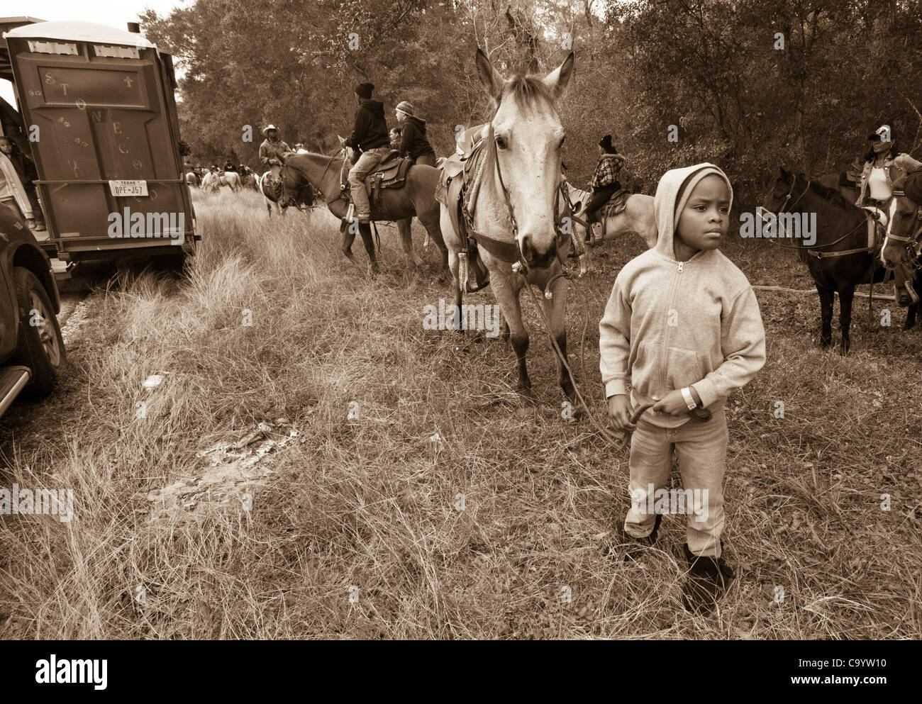 Taylor Glover, 8, looks for her family with her horse reigns in hand ...