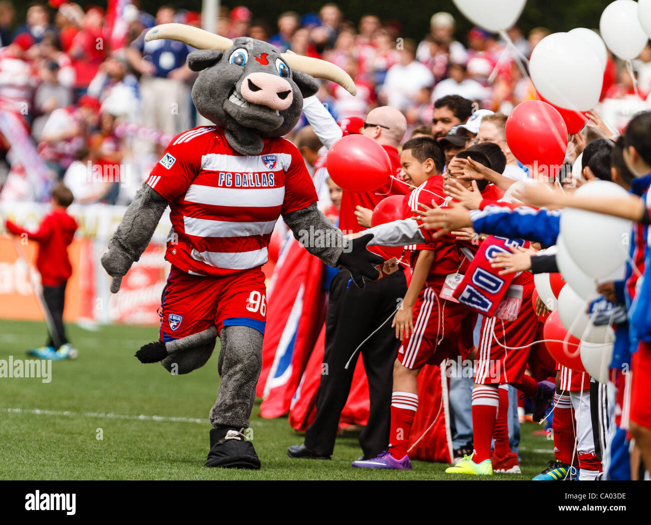 March 11, 2012 - Frisco, Texas, US - FC Dallas mascot ''Toro'' slaps ...