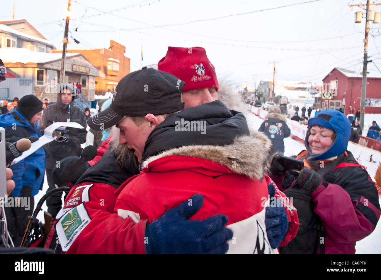 Winner Dallas Seavey hugs 2nd place Aliy Zirkle after she arrives in ...